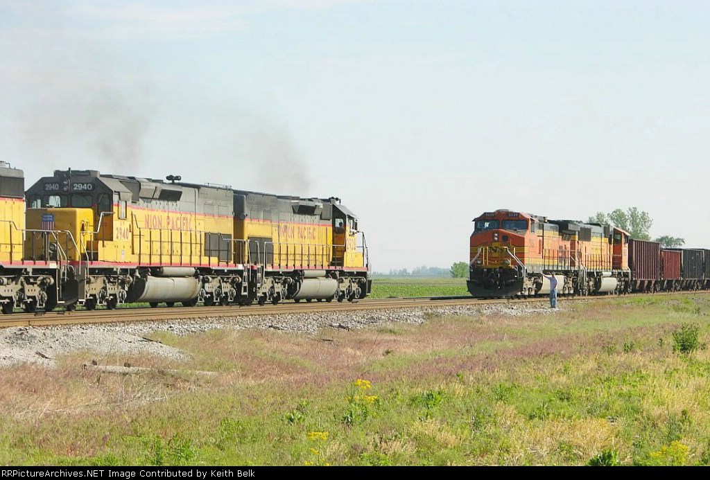 UP 2928 and 2940 passing BNSF 5039